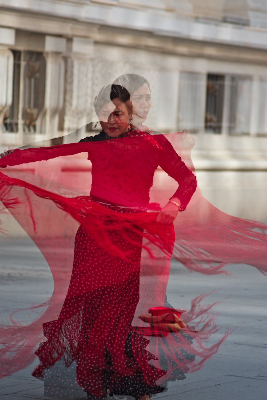 Flamenco dancer performing in a red dress in Seville