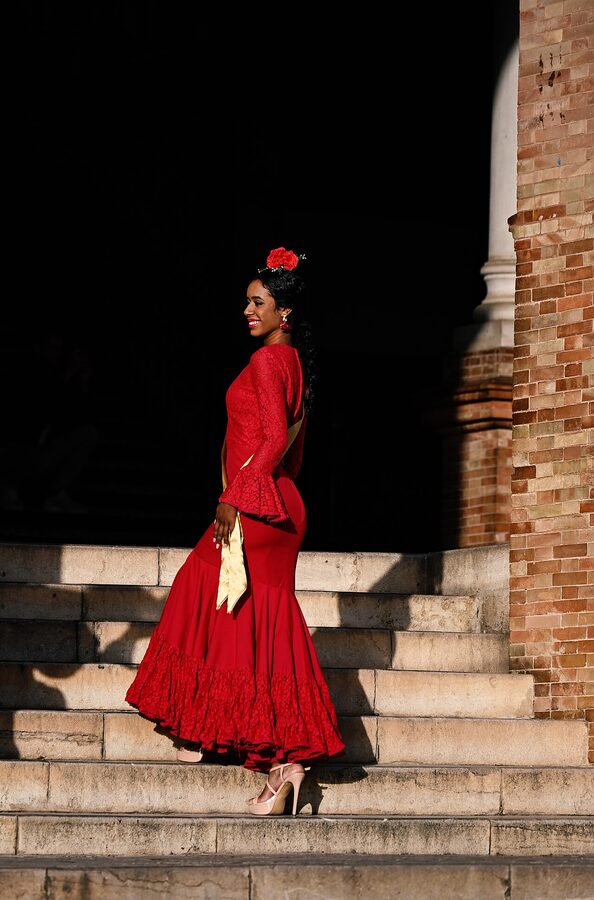 A flamenco dancer performing on a street in Seville Spain