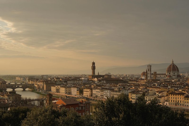 Panoramic view of Florence Italy at sunset with the Duomo cathedral and Arno River