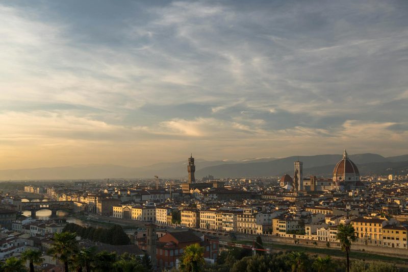Panoramic view of Florence at sunset featuring the famous Duomo and historical architecture
