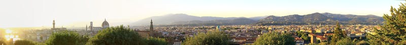 Panoramic view of Florence skyline at sunset showing the Cathedral and surrounding hills