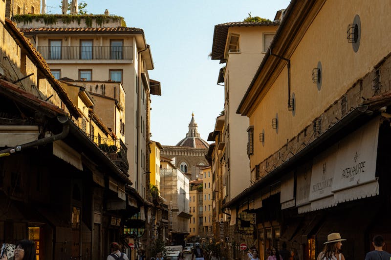 Charming street view of Florence with the iconic Duomo dome visible in the background
