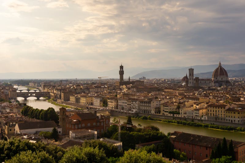 Florence skyline at sunset showing the Duomo and Arno River