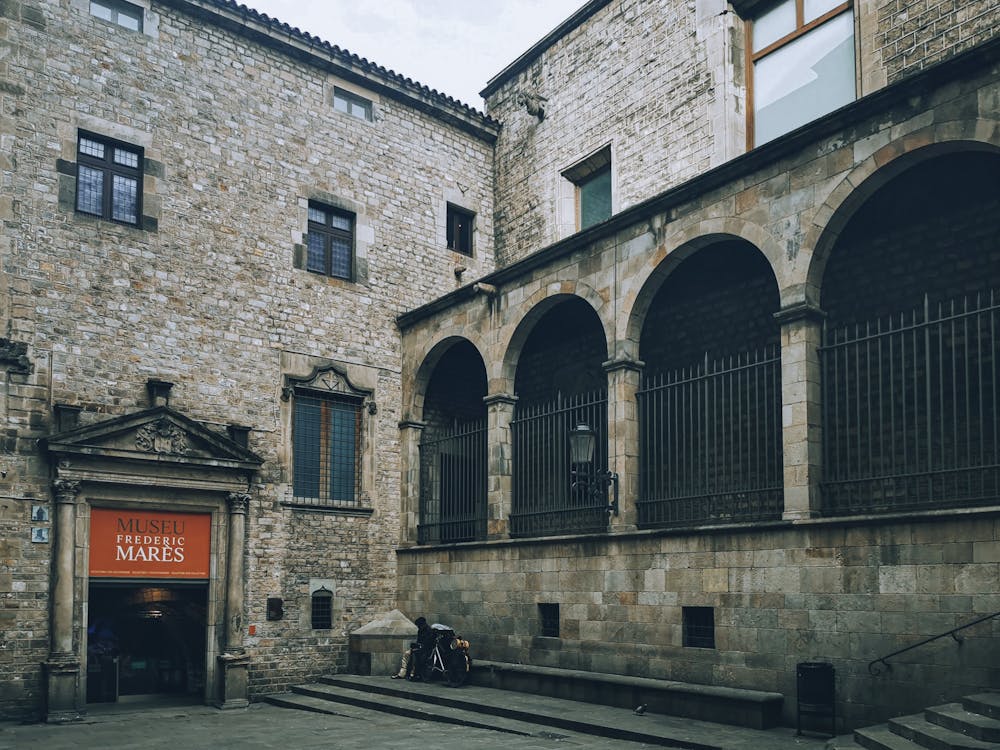 Historic stone arches and medieval courtyard at Frederic Mares Museum in Barcelona