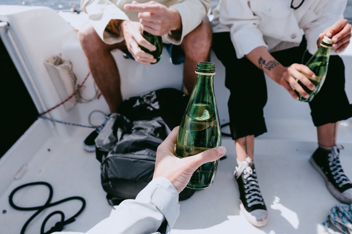 Group of friends enjoying drinks on a yacht at sea