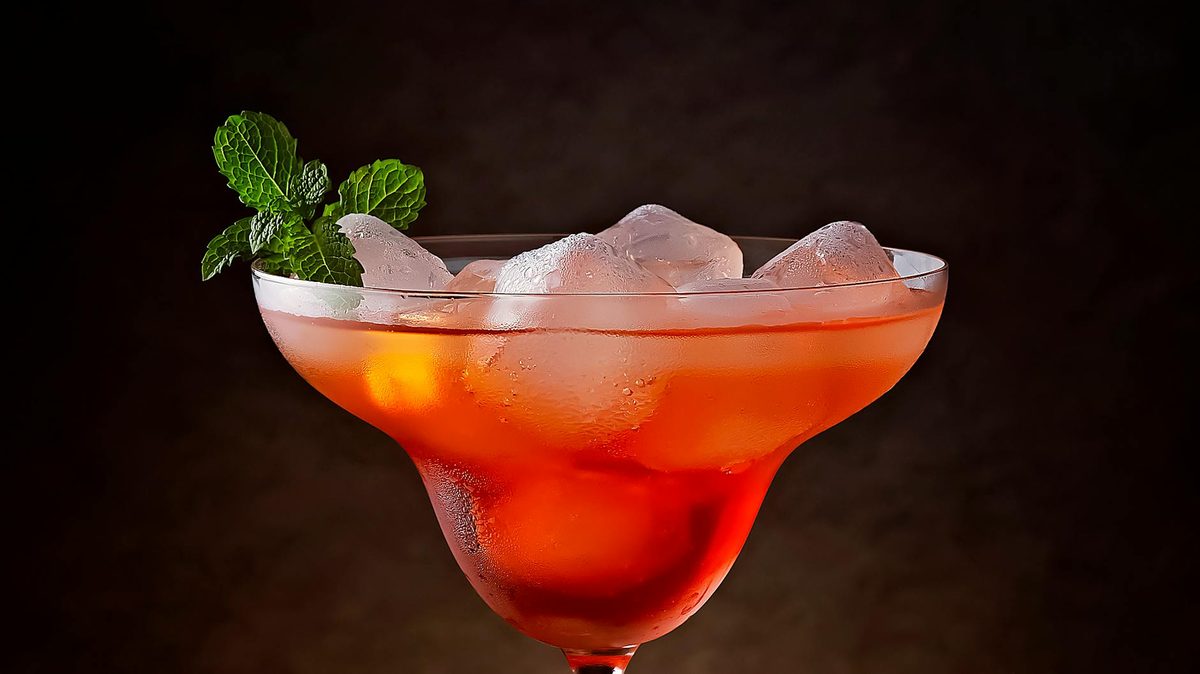 Chilled cocktail with ice and mint garnish