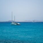 Catamaran sailing on turquoise waters off the Fuerteventura coast
