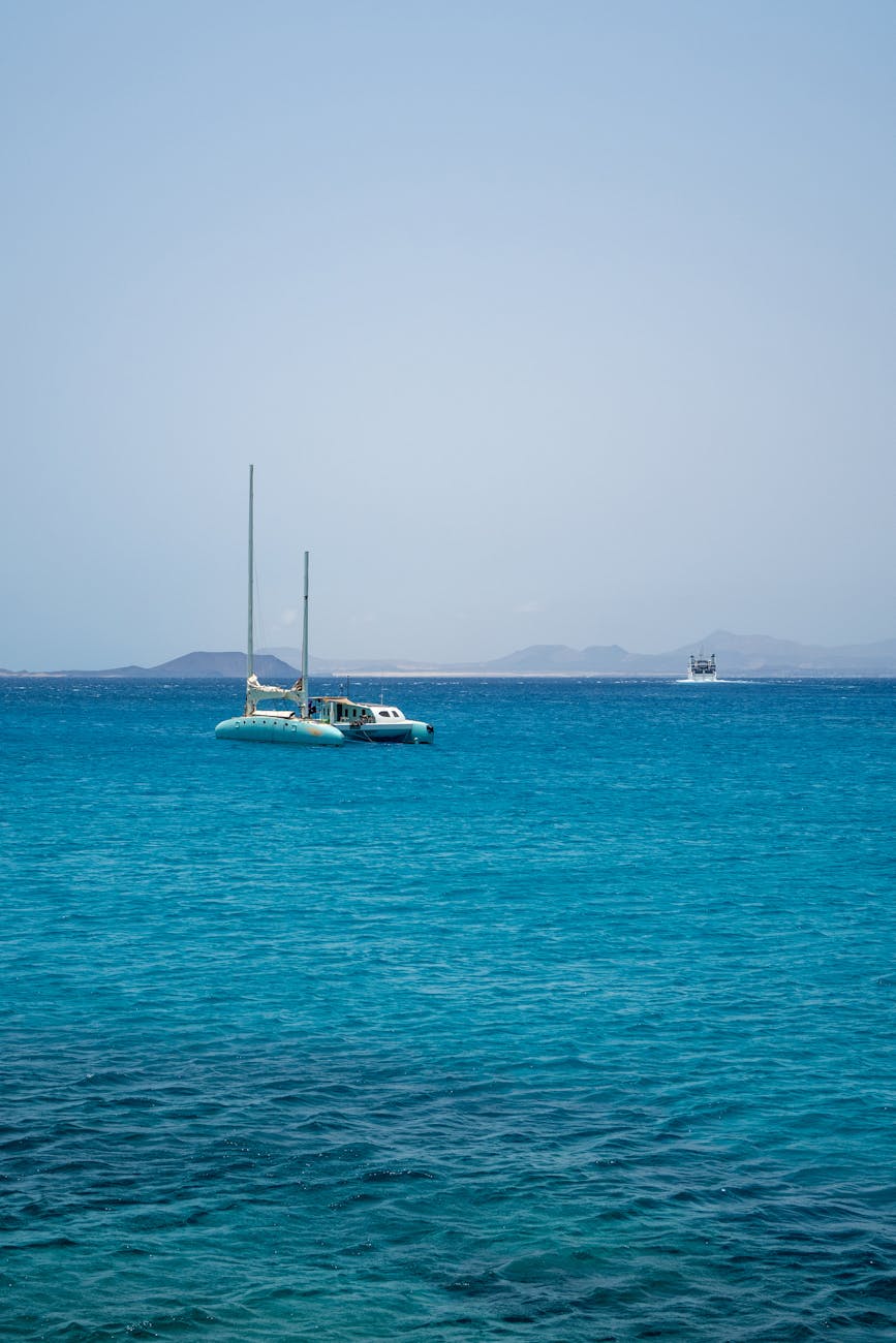 Catamaran sailing on turquoise waters off the Fuerteventura coast