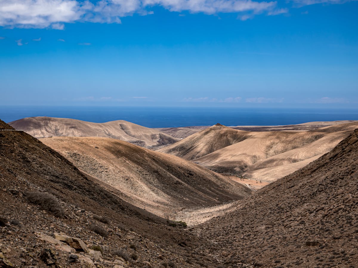 Desert terrain of Fuerteventura with sweeping hills and barren landscape