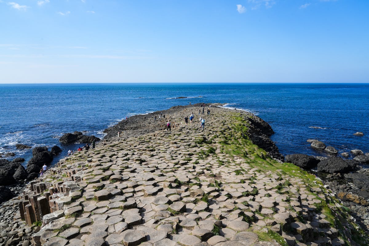 Basalt rock formations at Giants Causeway with the Atlantic Ocean behind