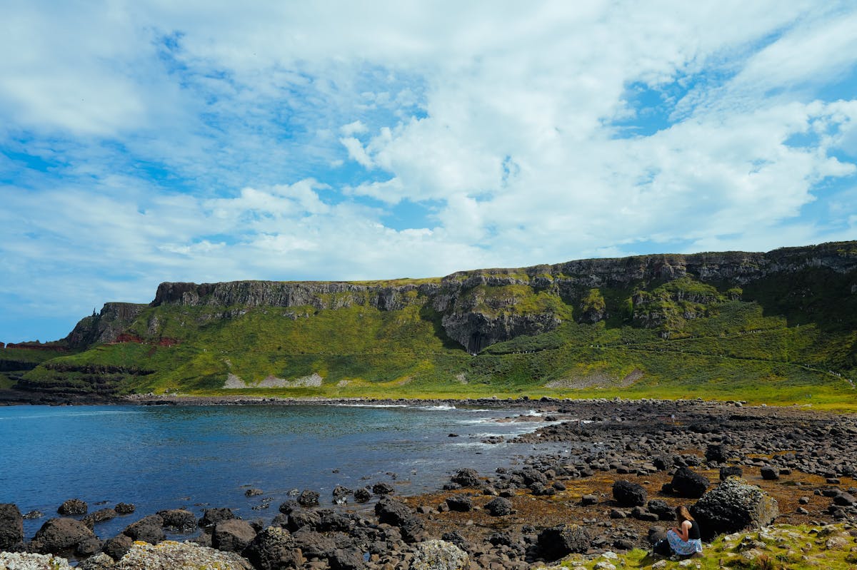 Lush green coastal cliffs along the Causeway Coast in Northern Ireland