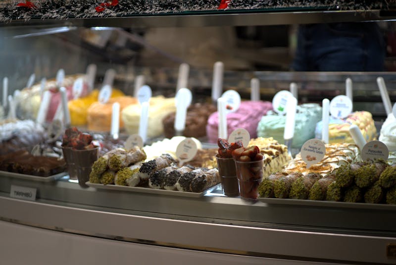 Colorful ice cream and desserts on display in a gelato shop in Florence Italy