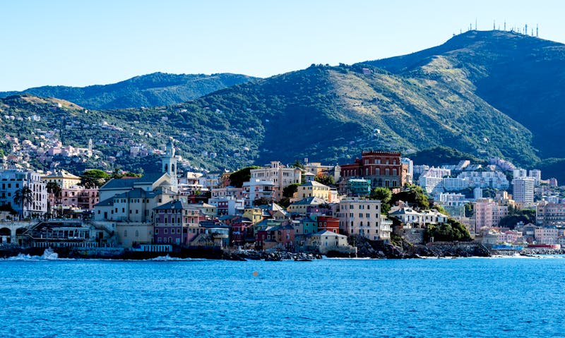 Beautiful coastal view of Genoa with colorful buildings and scenic hills