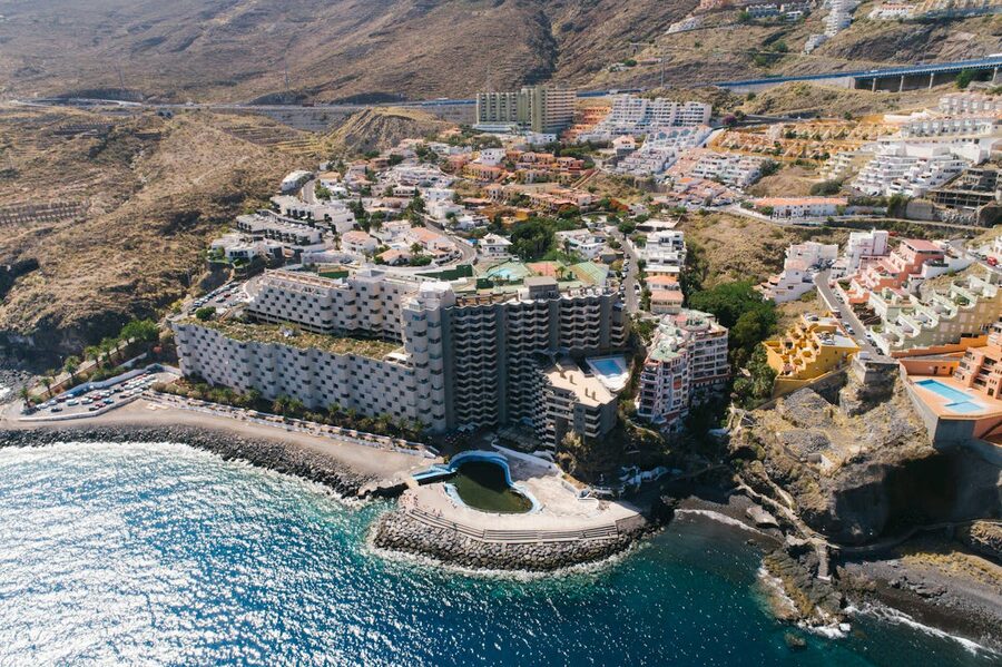 Scenic aerial view of a coastal resort in Gran Canaria with mountains