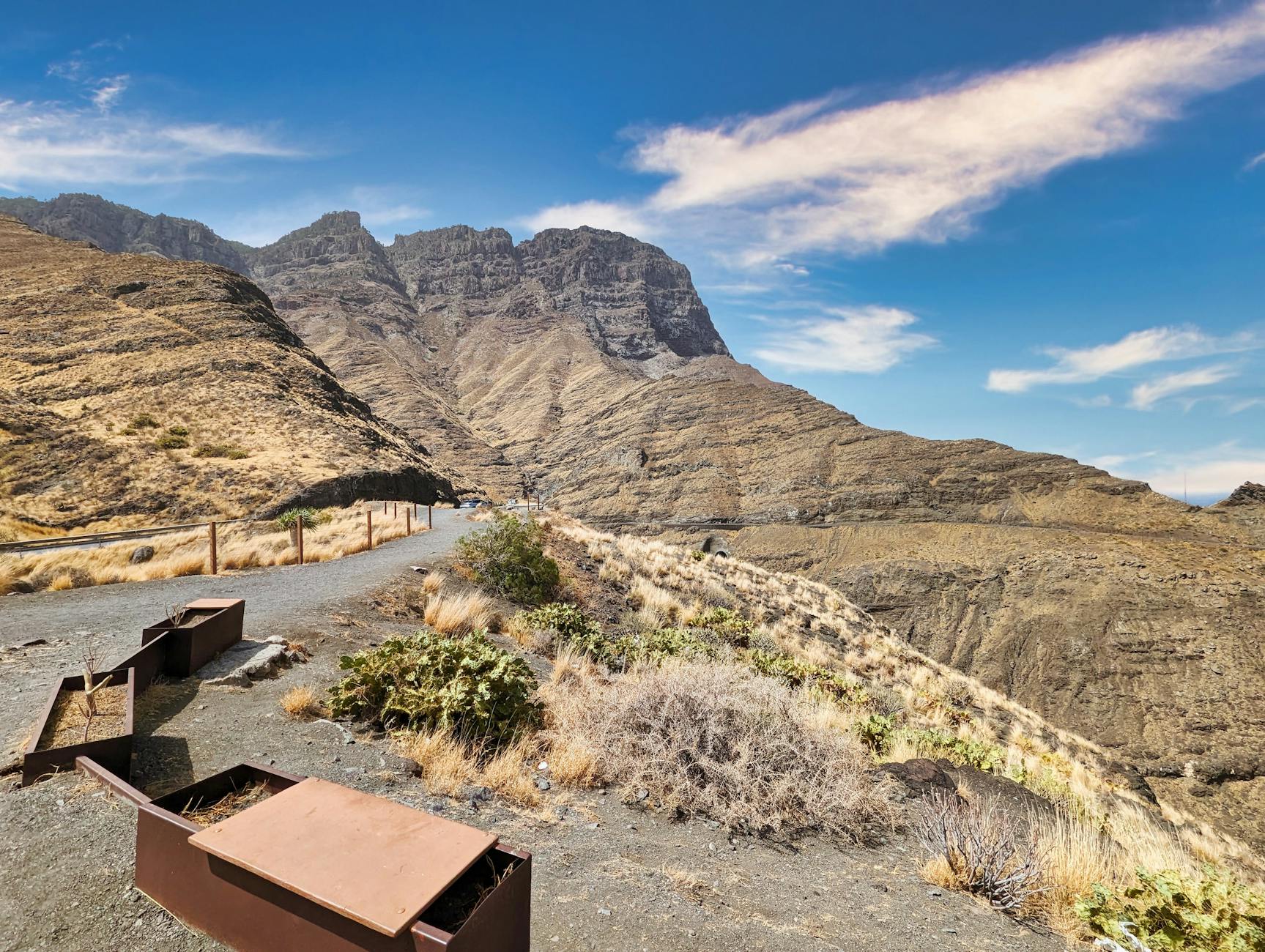 Rugged mountains and hiking path in Gran Canaria under clear sky