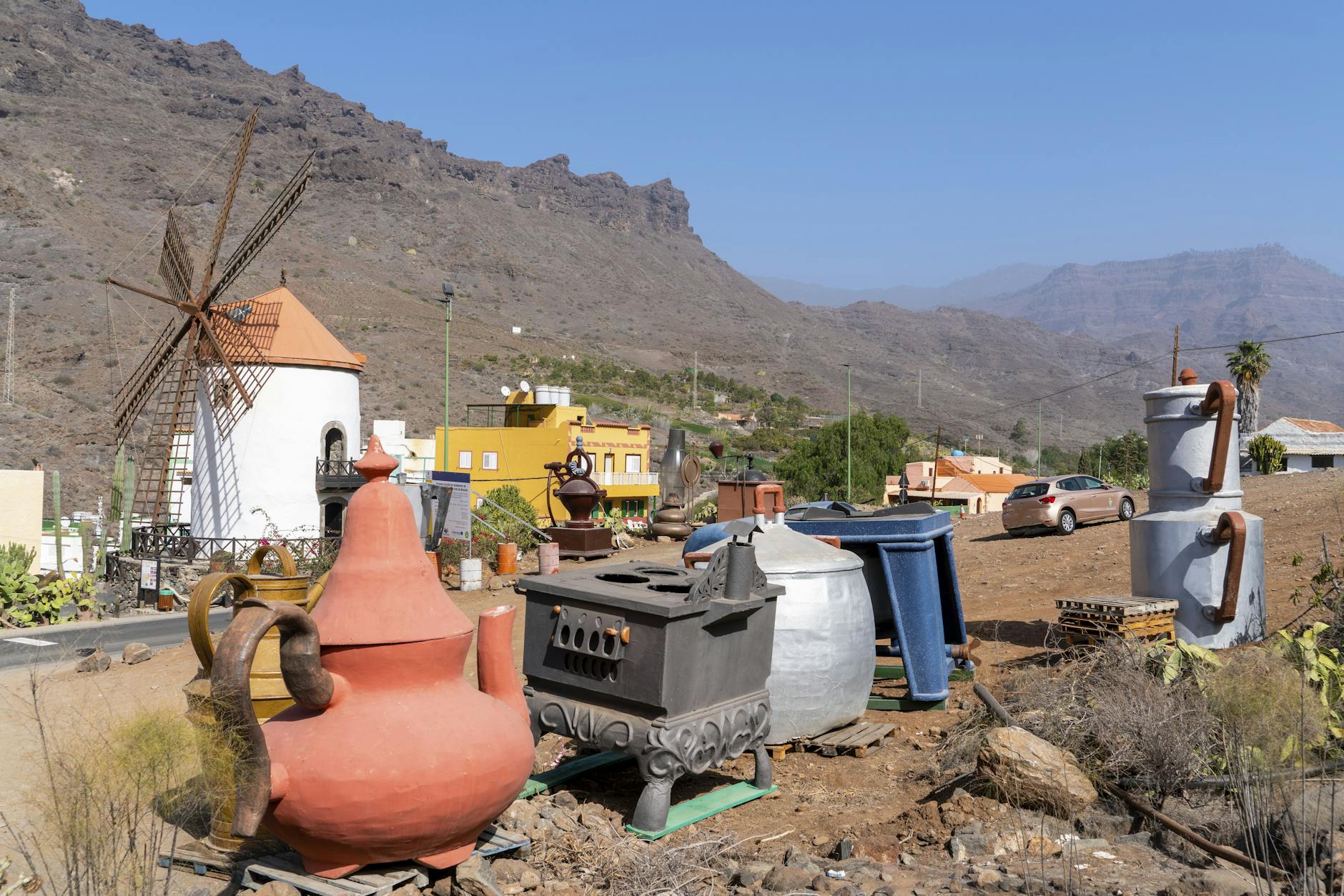 Traditional windmill and vintage pottery at roadside stop in Gran Canaria