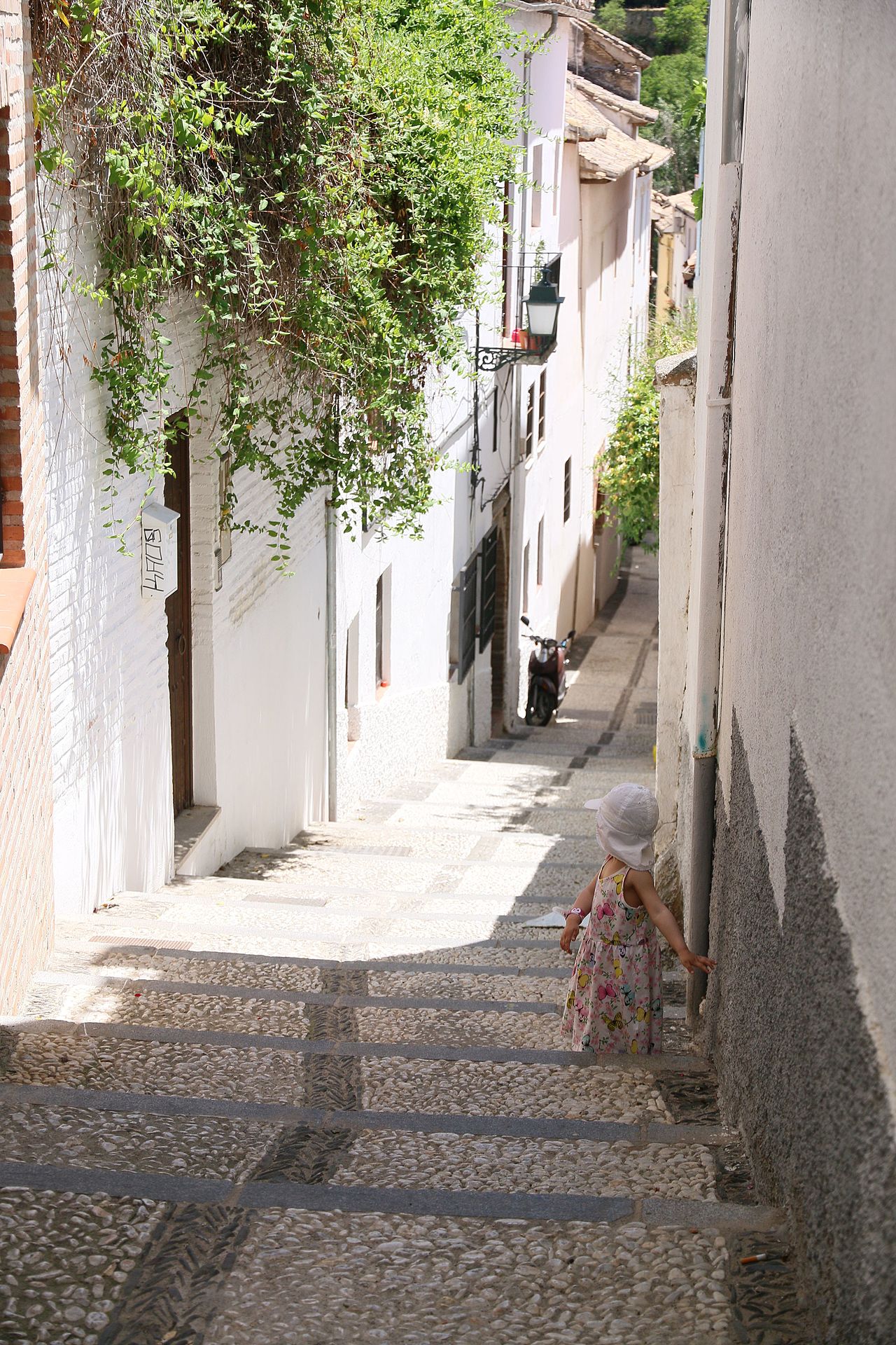 Narrow white street in the Albaicin quarter of Granada Spain