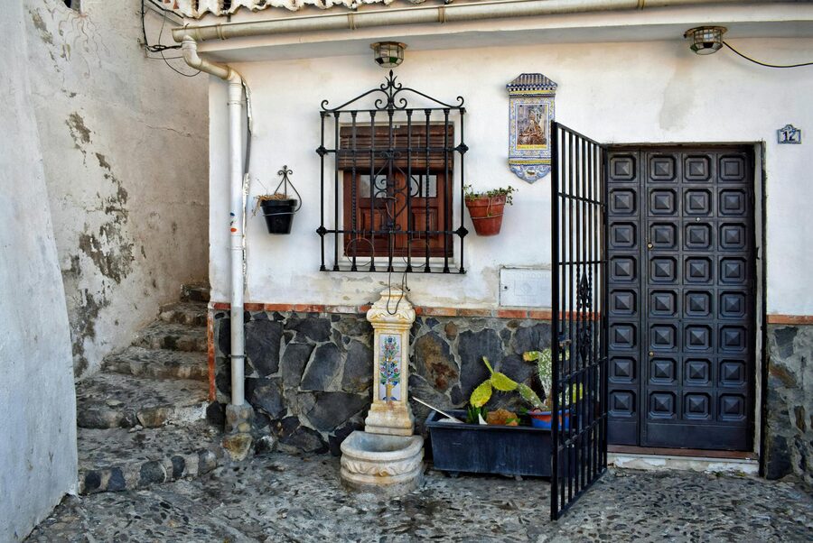 Traditional Spanish courtyard with arches and plants in Granada Spain