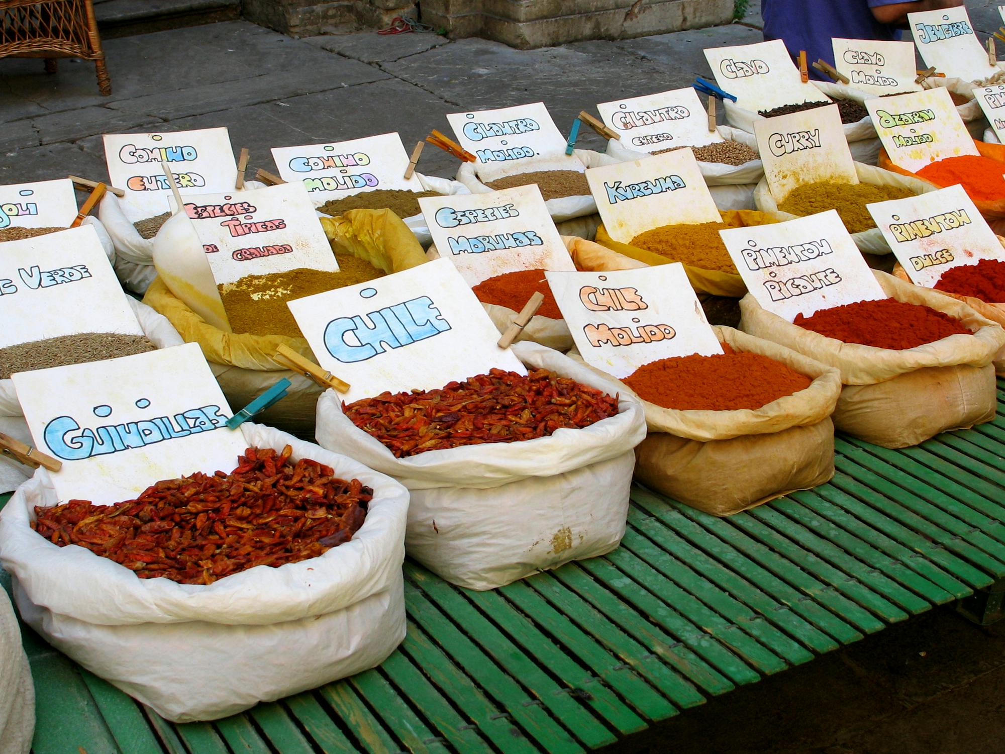 Colorful spices on display at a street market in Granada Spain