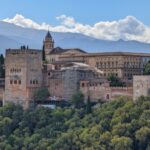 The Alhambra palace complex with the Sierra Nevada mountains behind it in Granada Spain