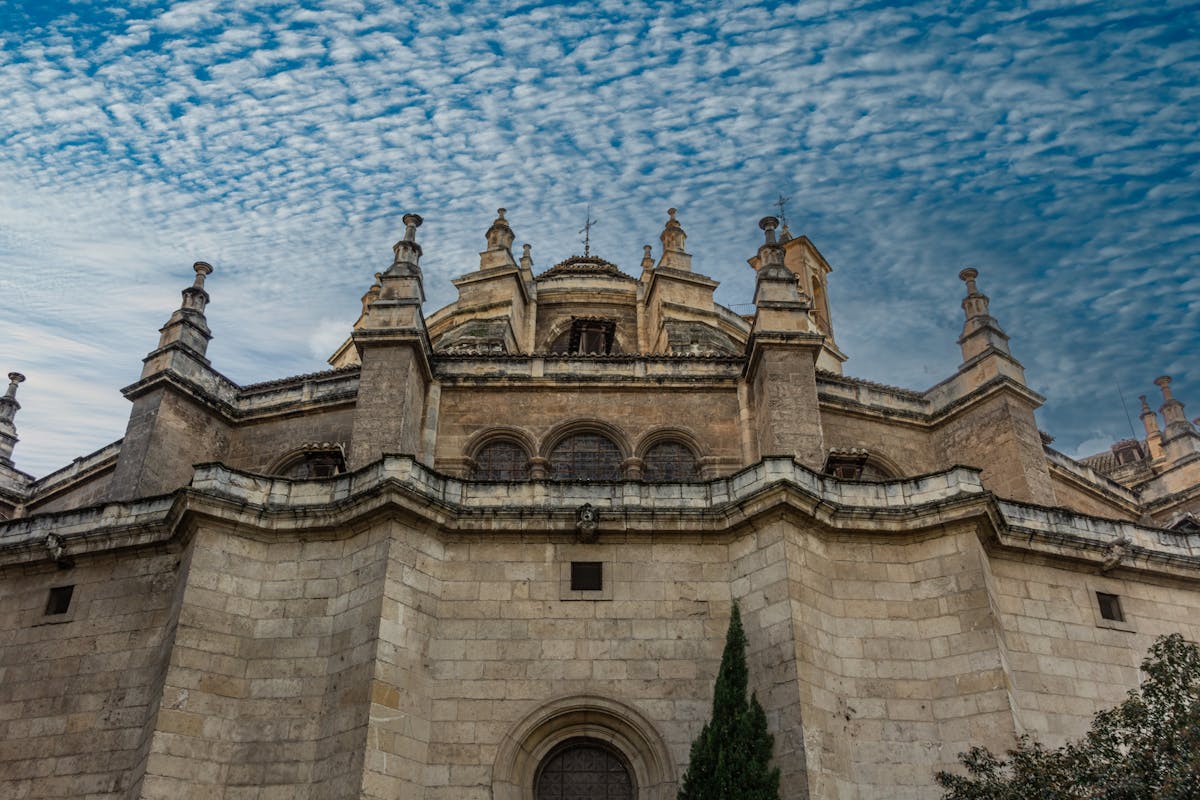 The exterior facade of Granada Cathedral with Gothic and Renaissance architectural details