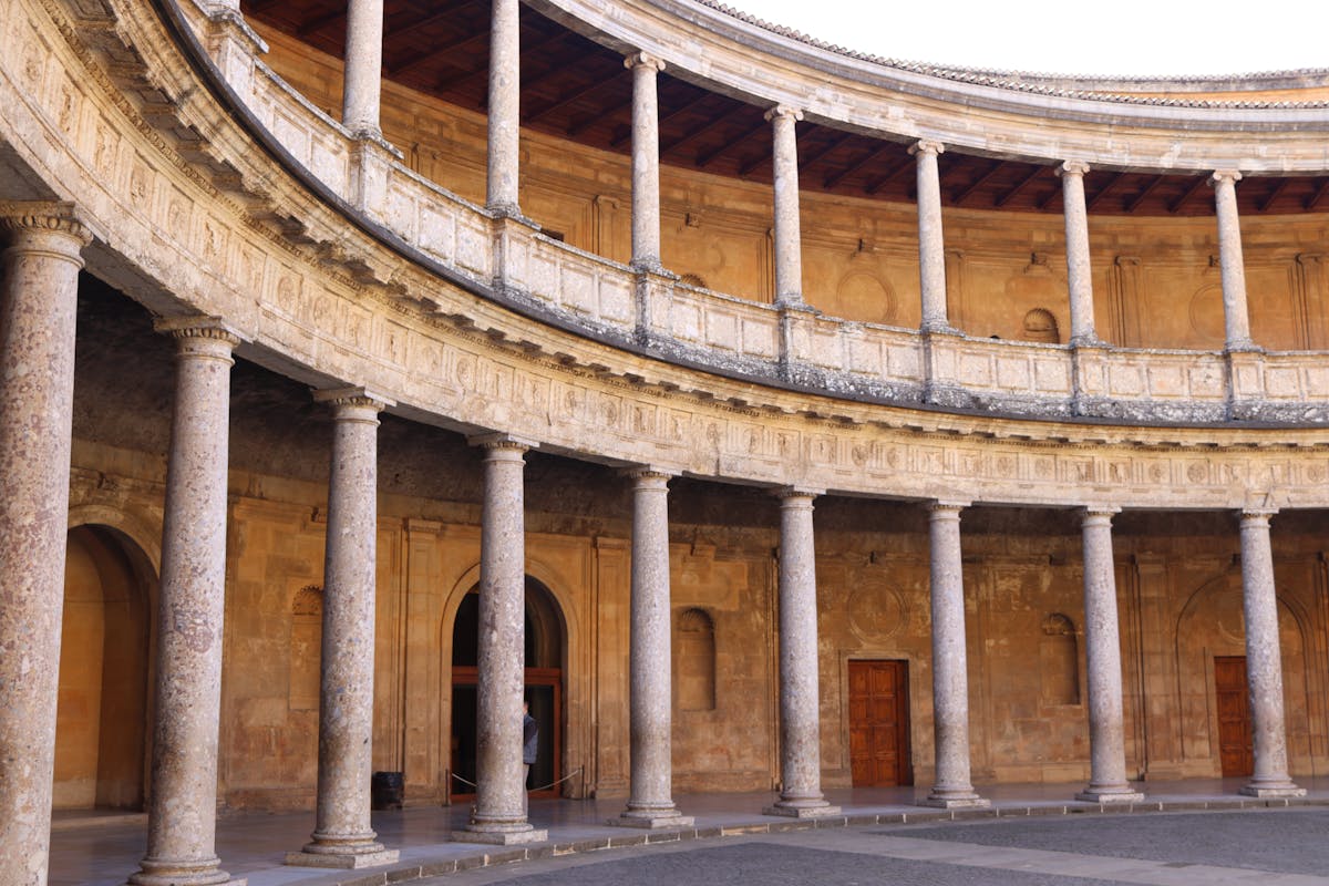 Circular Renaissance courtyard with columns inside the Palace of Charles V at the Alhambra in Granada Spain