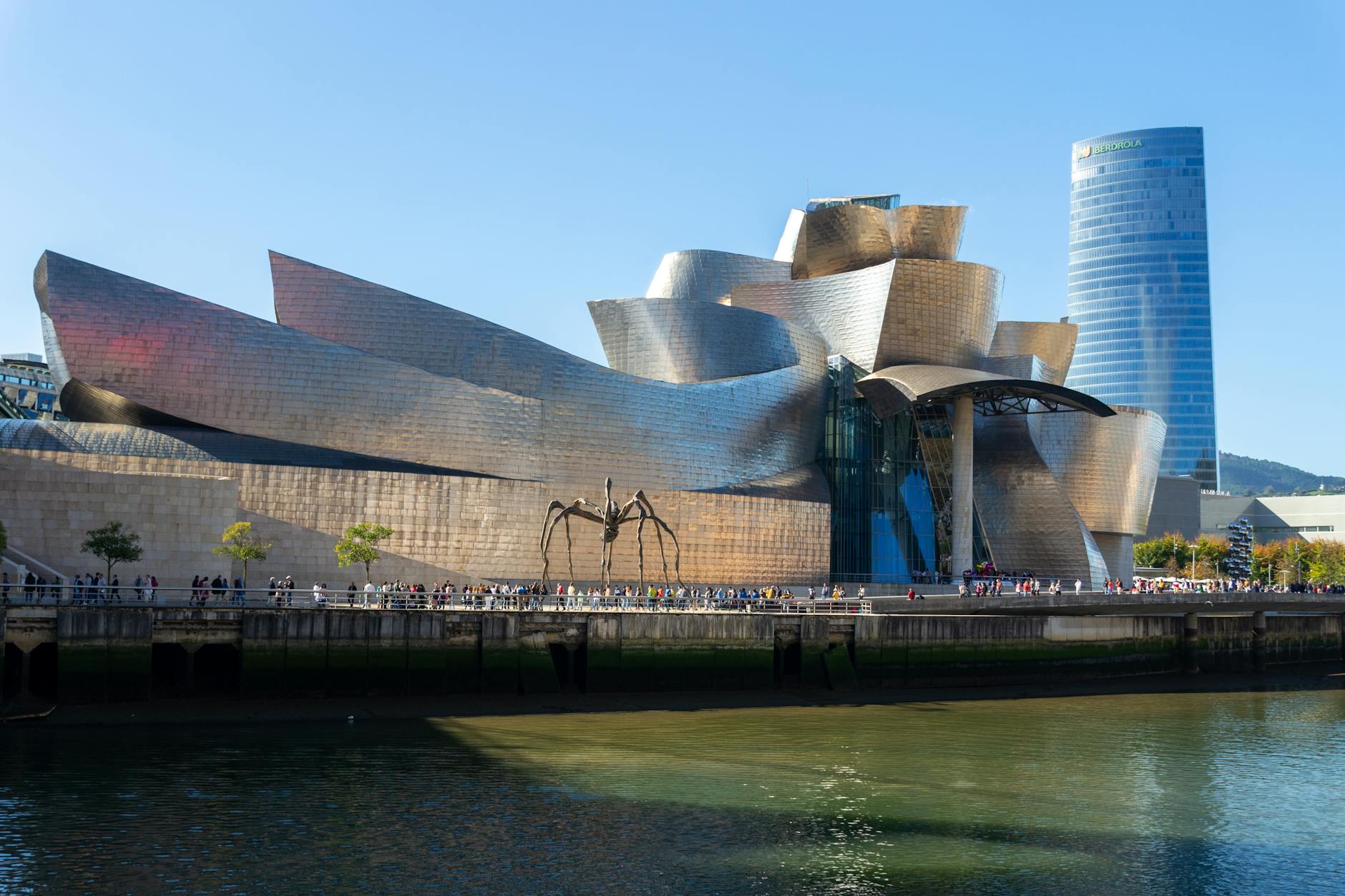 The iconic titanium curves of the Guggenheim Museum Bilbao reflecting sunlight