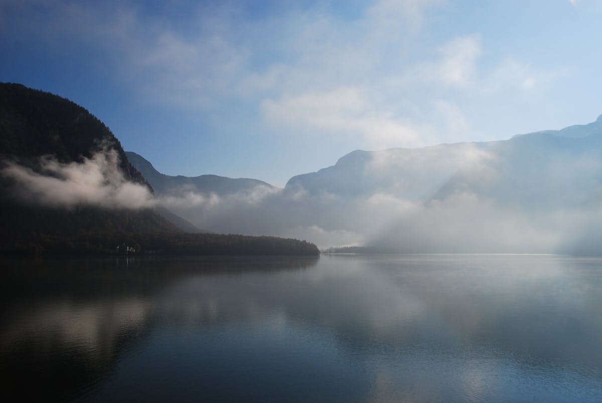 Mist over Lake Hallstatt surrounded by mountains