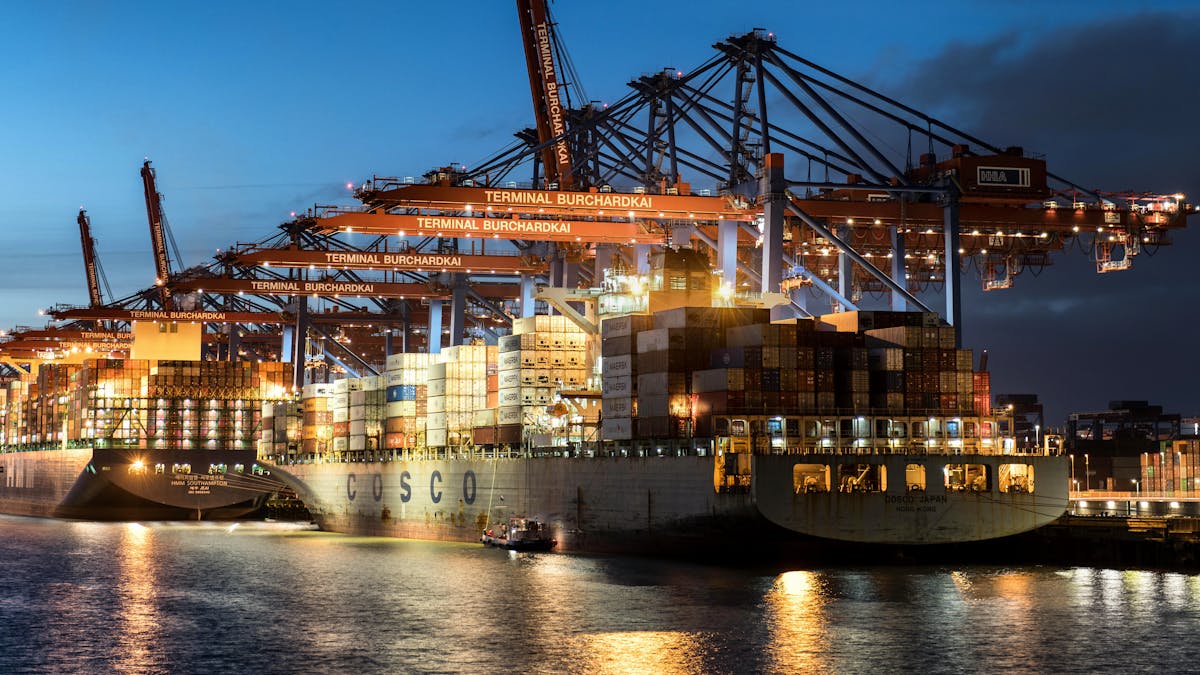 Evening view of cargo operations at Terminal Burchardkai in Hamburg harbor