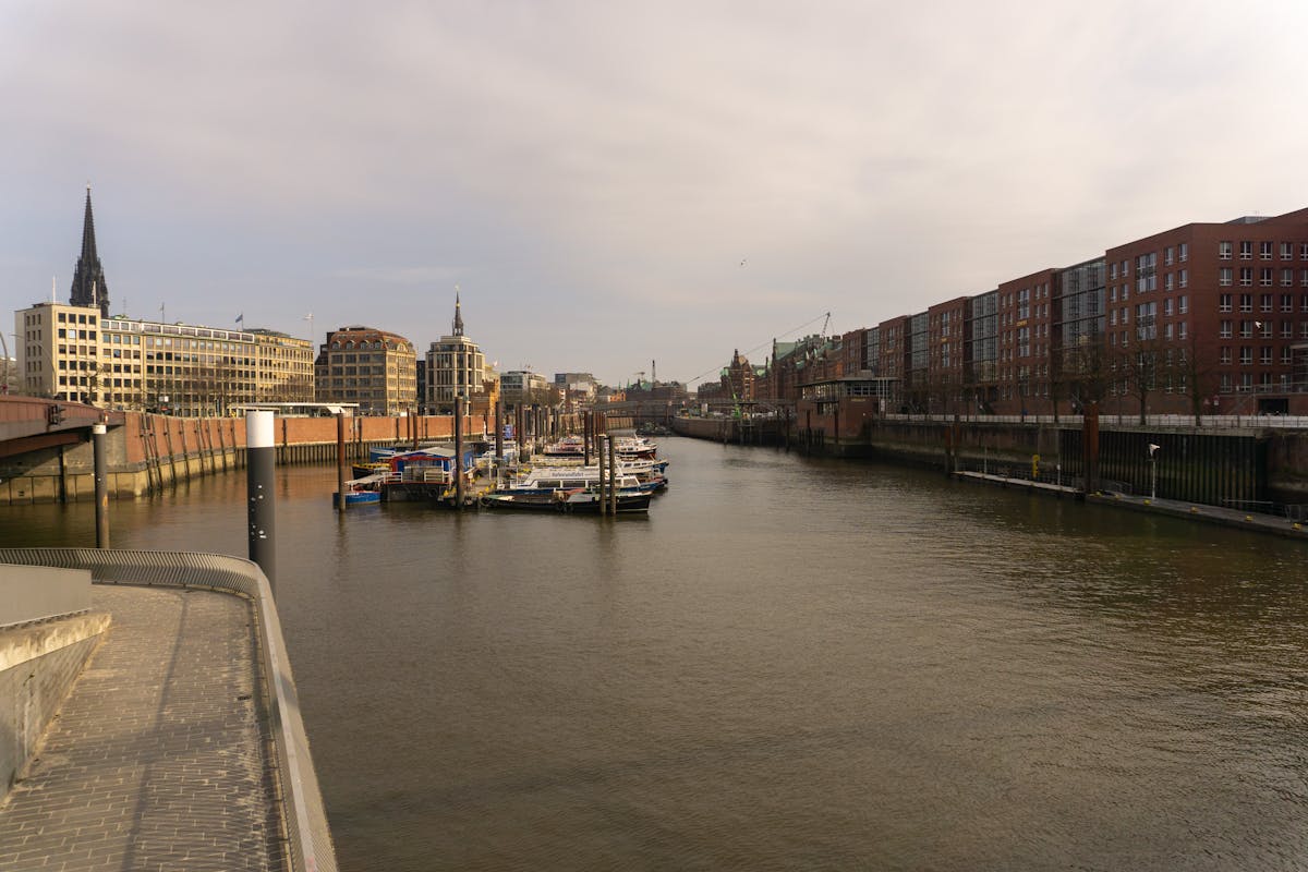Modern architecture at Hamburg port with calm waters and contemporary buildings