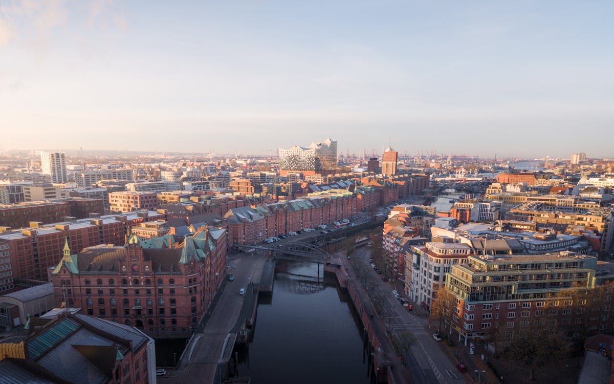 Aerial view of the historic Speicherstadt warehouse district in Hamburg with red brick buildings and canals