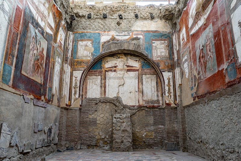 Colorful ancient Roman frescoes painted on interior walls at the Herculaneum archaeological site in Ercolano Italy