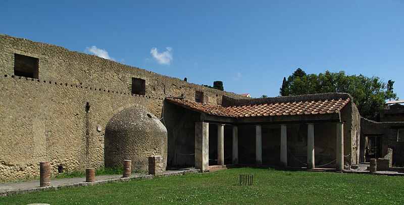 Wide panoramic view of excavated streets and buildings of ancient Herculaneum