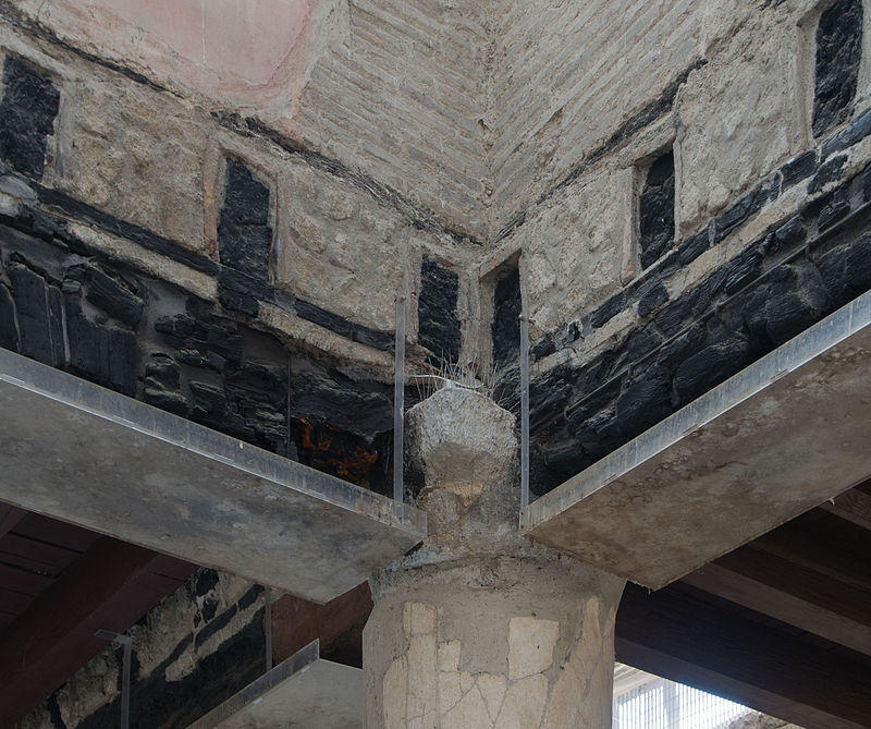 Carbonized wooden ceiling beams preserved by volcanic heat at the Hall of the Augustals in Herculaneum