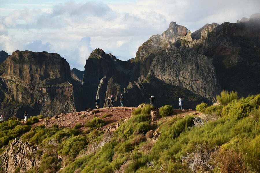 Hikers enjoying panoramic views from Madeira mountain trail