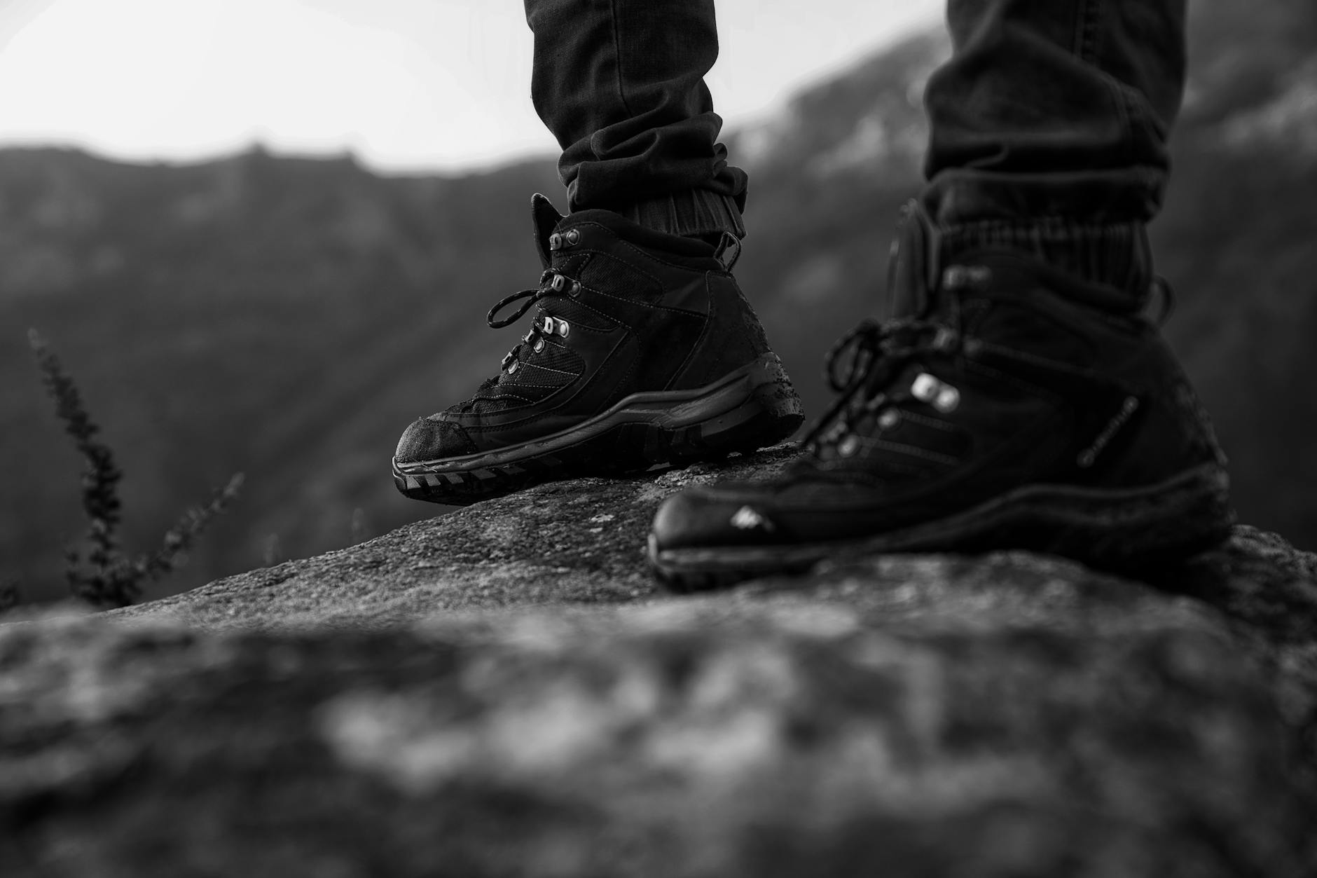 Close-up of hiking boots on a rock