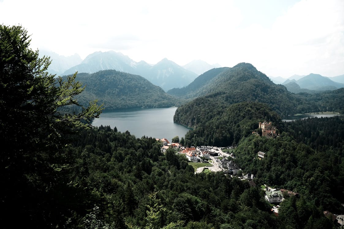 Hohenschwangau Castle set against a scenic Bavarian Alps landscape with lake