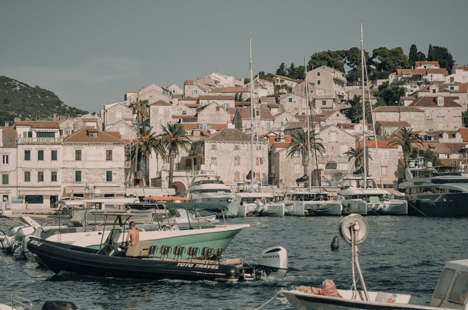 Hvar town waterfront with boats and traditional stone architecture