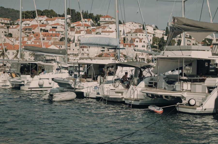 Yachts moored in Hvar's picturesque harbor under clear skies
