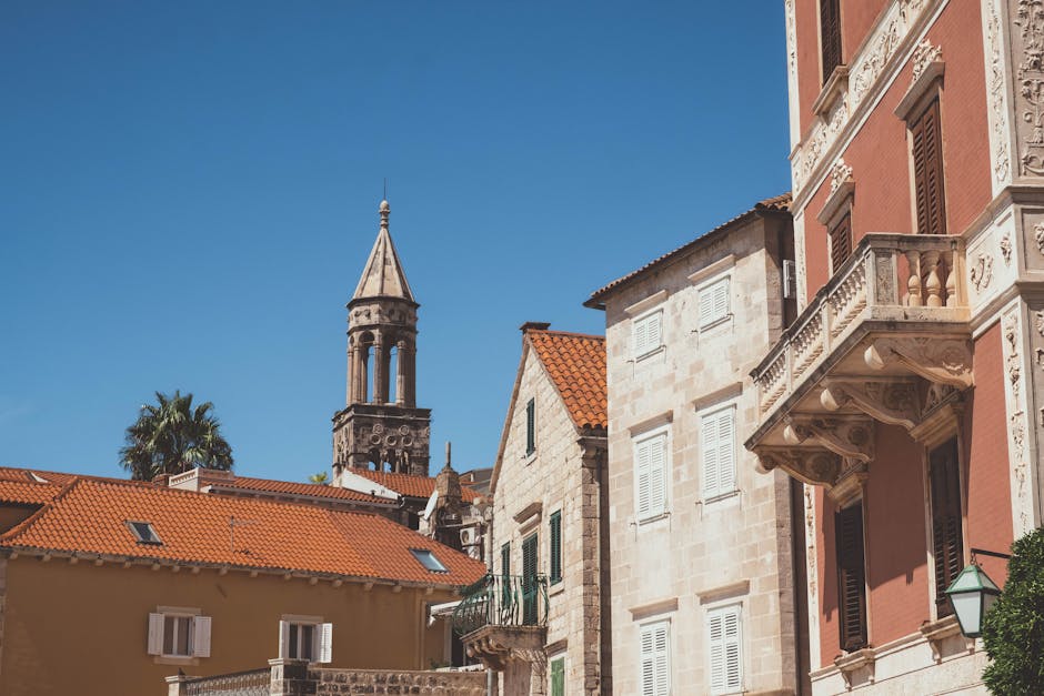 Historic stone buildings of Hvar town against a blue sky