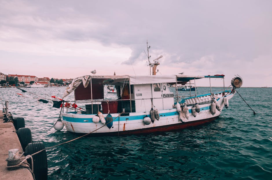Traditional fishing boat docked at a harbor on the Croatian coast