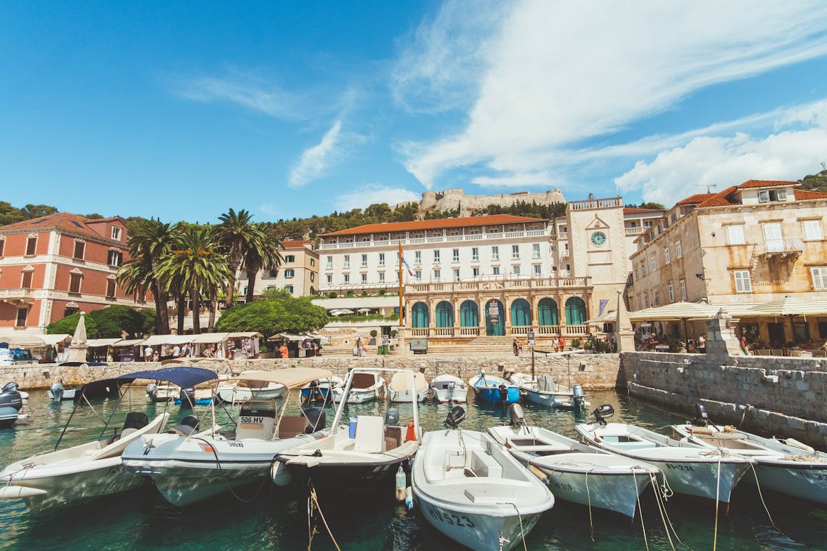 Harbor scene in Hvar Croatia with boats and historical buildings