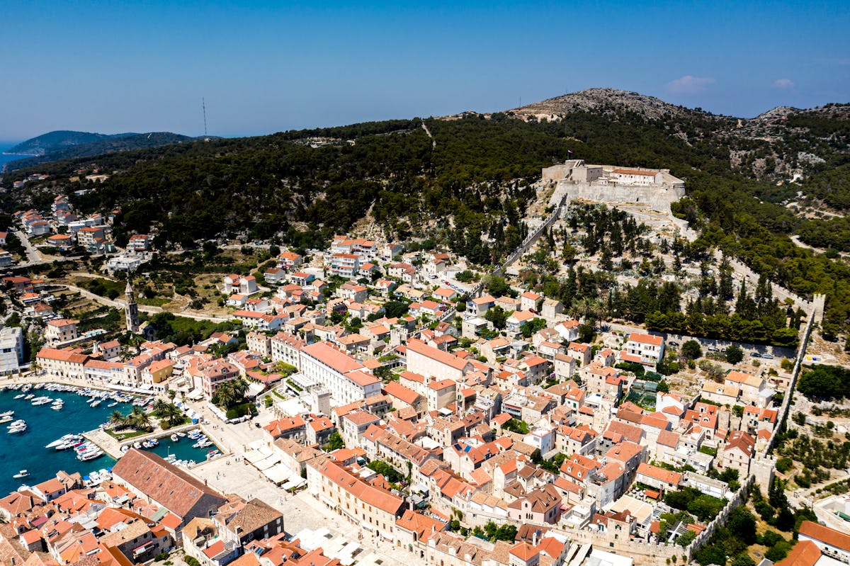 Aerial view of Hvar town showing coastline and historic architecture
