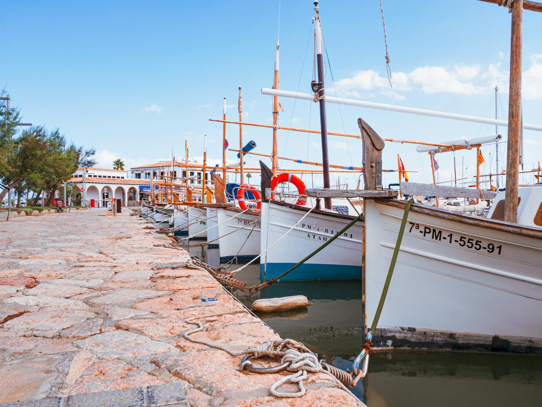 Marina with moored boats on a sunny day in Ibiza, Spain