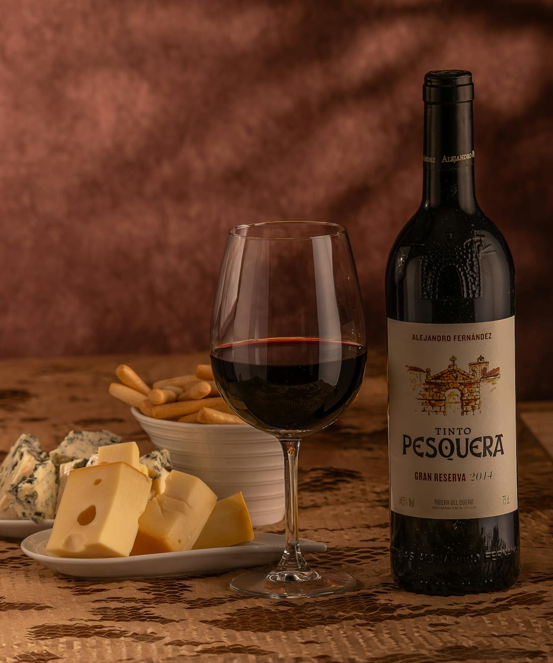 Wedge of smoked Idiazabal cheese paired with quince paste