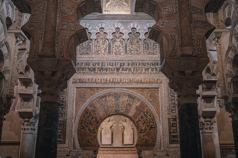 The intricate arches and Islamic motifs of the Mosque-Cathedral of Cordoba showcasing historical ornate architecture