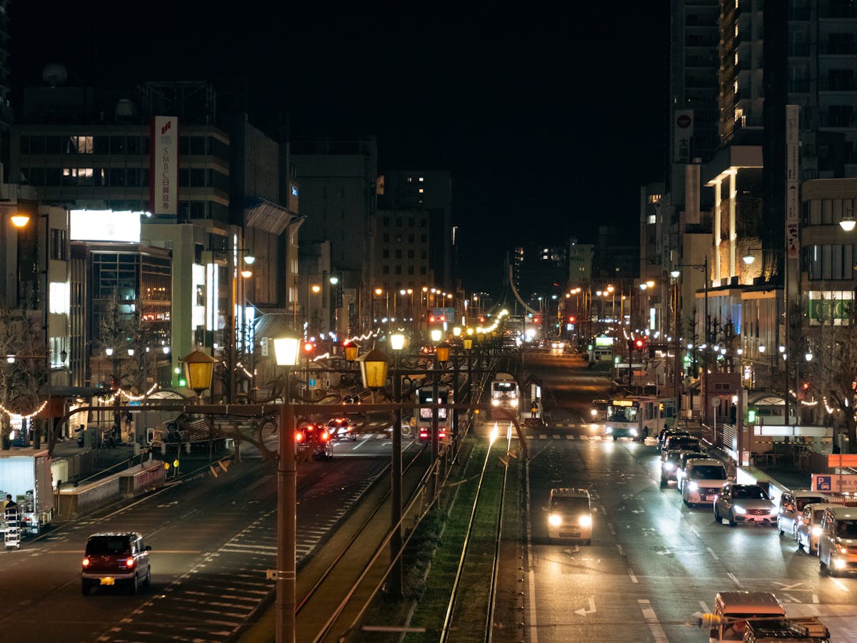 Narrow street in Malaga old town illuminated at night with warm lighting