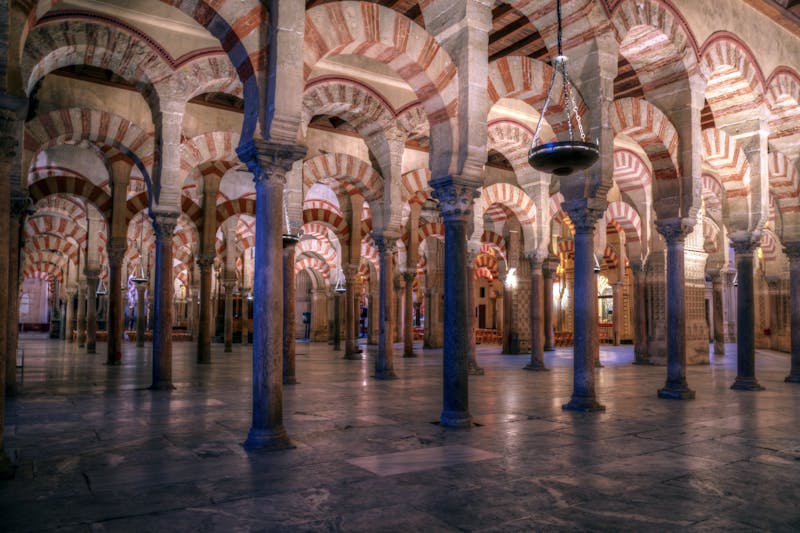 Stunning view of the iconic Moorish red and white arches inside La Mezquita in Cordoba Spain