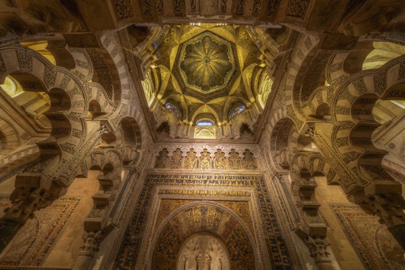 Elaborate arches and decoration inside the Mosque-Cathedral of Cordoba Spain