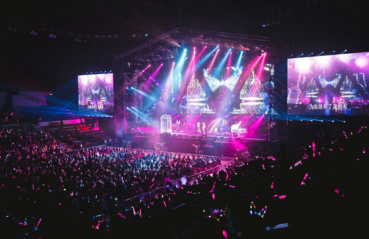 Colorful live concert with vibrant lighting energetic crowd and dynamic stage